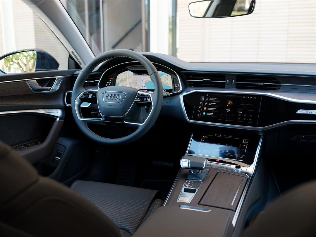 The classic design of three large screens on the center console, the ...