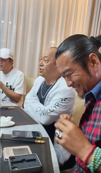 59-year-old Sun Xing was partying with friends, wearing a turquoise ...