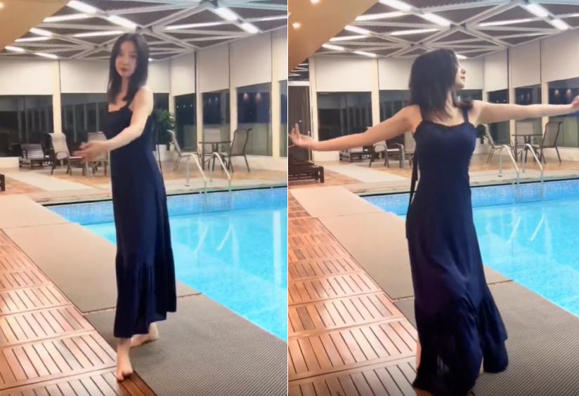 Liu Yan dances barefoot by the pool, wearing a long skirt with ...
