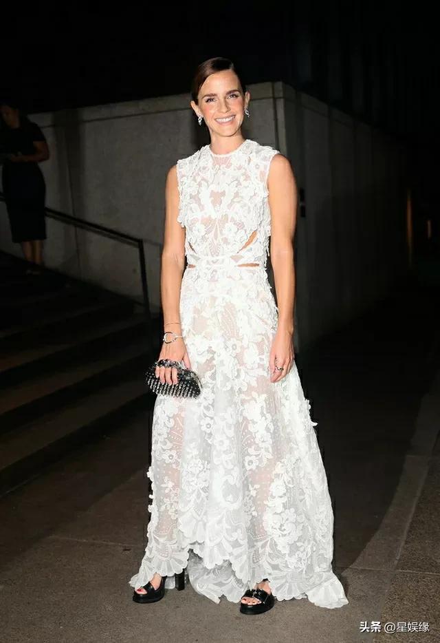 Emma Watson smiled sweetly to the camera in a lace halter dress - iNEWS