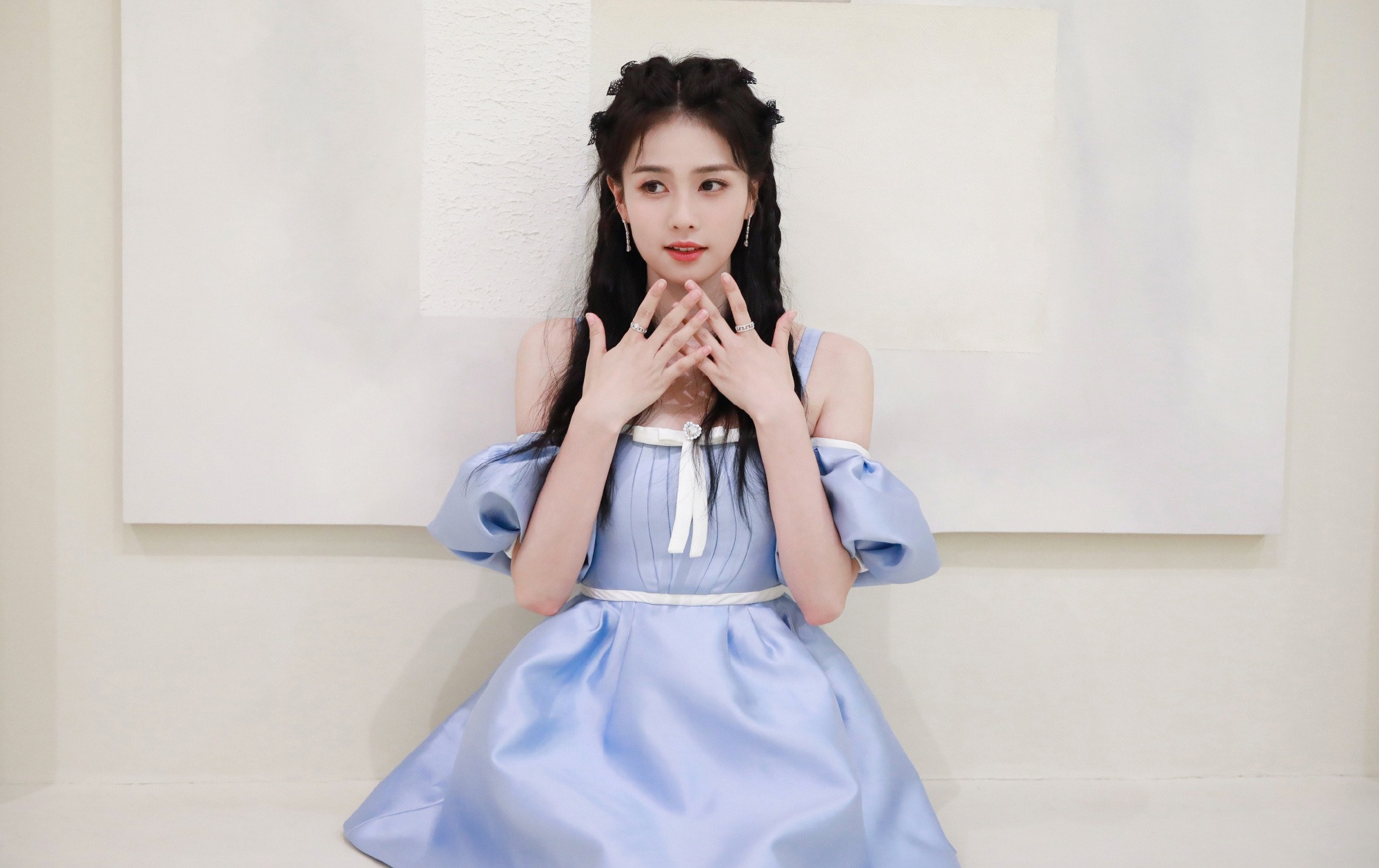 Bailu looks like a princess on the run in a light blue off-the-shoulder ...