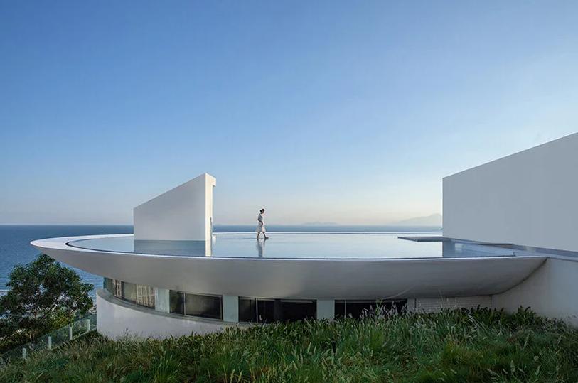 The design of this white circular library presents a poetic beauty - iNEWS