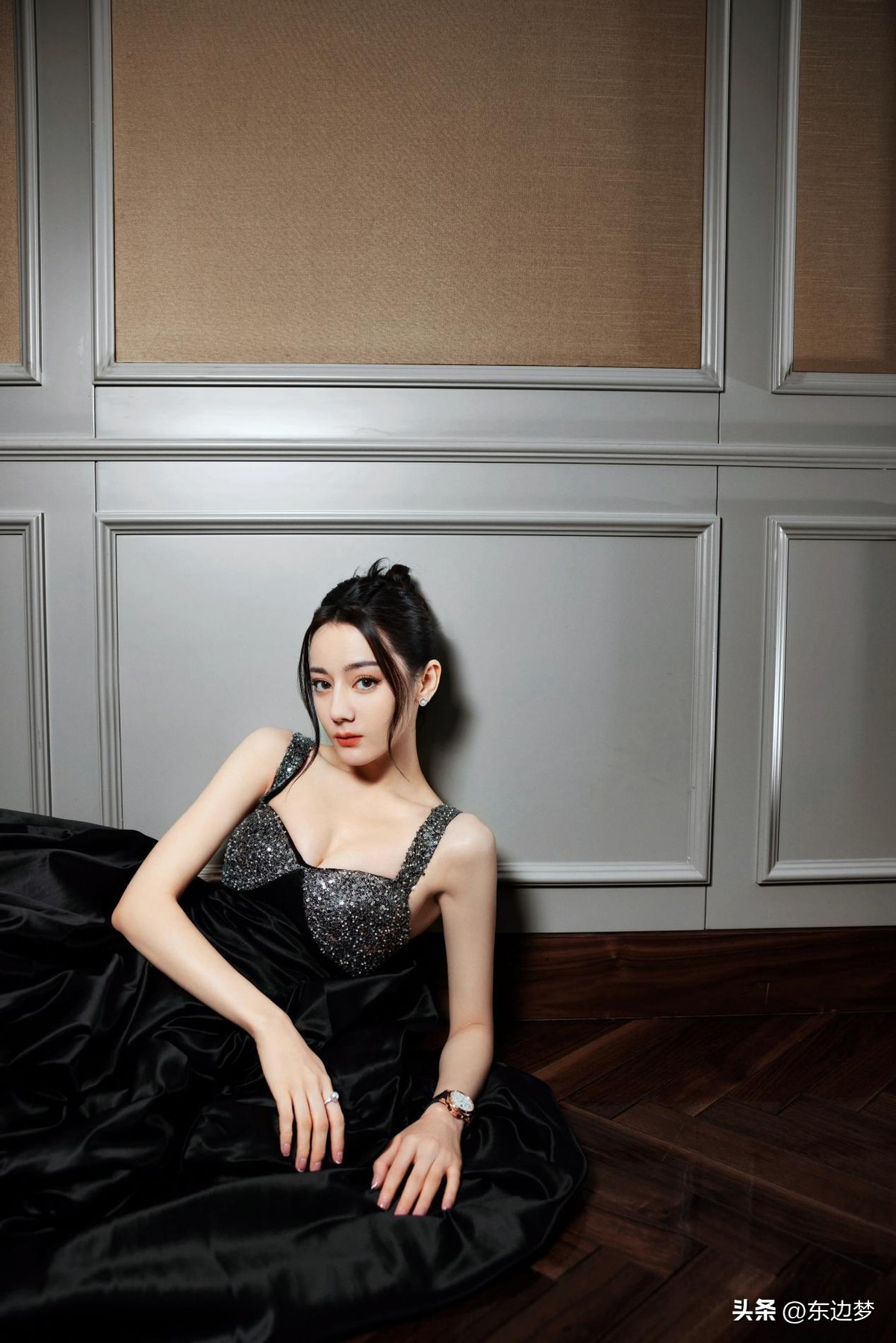 Di Ali Gerba's recent photo exposure, wearing a black suspender dress ...