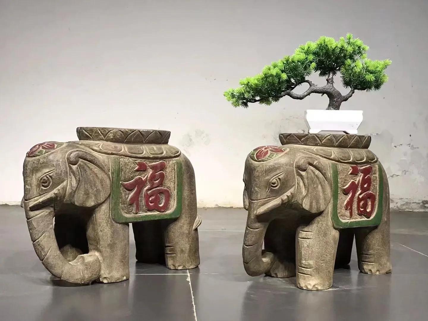 A pair of bluestone painted lucky elephants in size.40 long.The high 30 ...