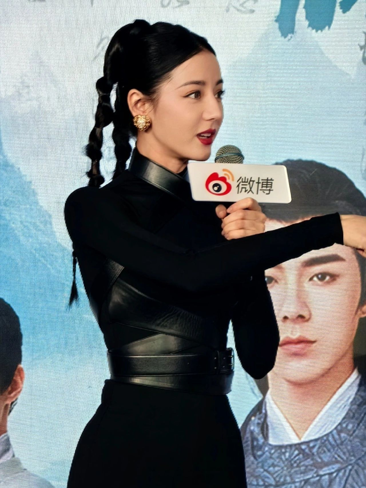 Reba wears vintage Dior earrings, and her graceful black dress is ...