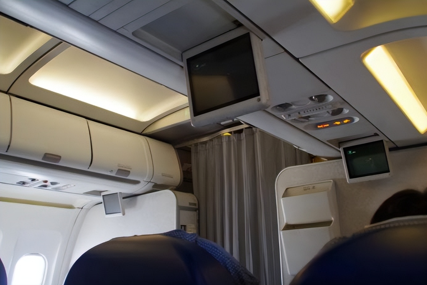 Why do stewardesses have to close the first-class curtain after the ...