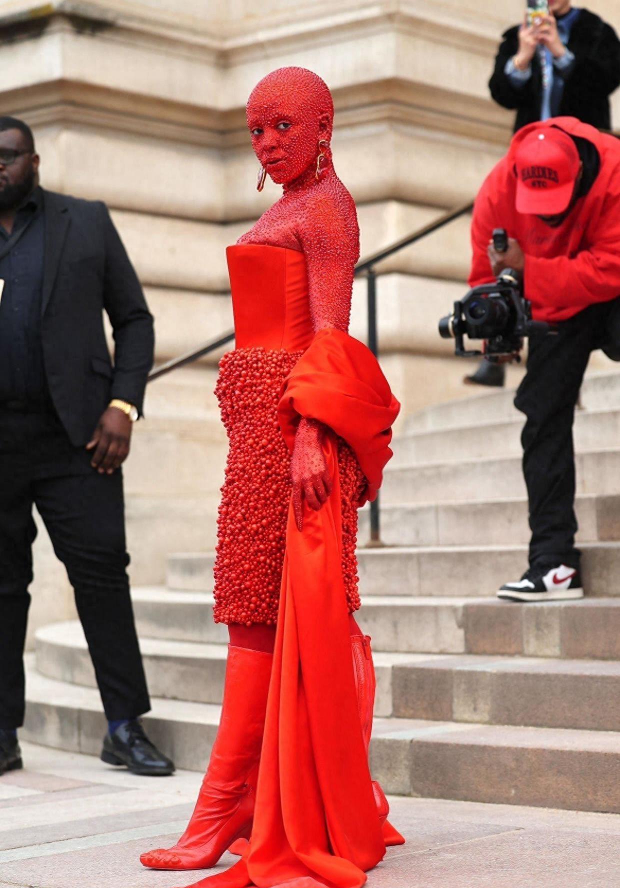 The actress' body is studded with 30,000 red crystals, which are ...