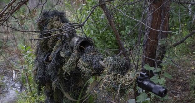 Why do snipers wrap their sniper rifles with rag strips of cloth when ...