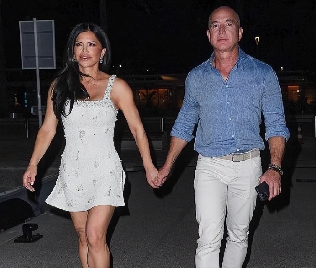 A recent photo of Bezos' 53-year-old fiancee, wearing a suspender dress ...