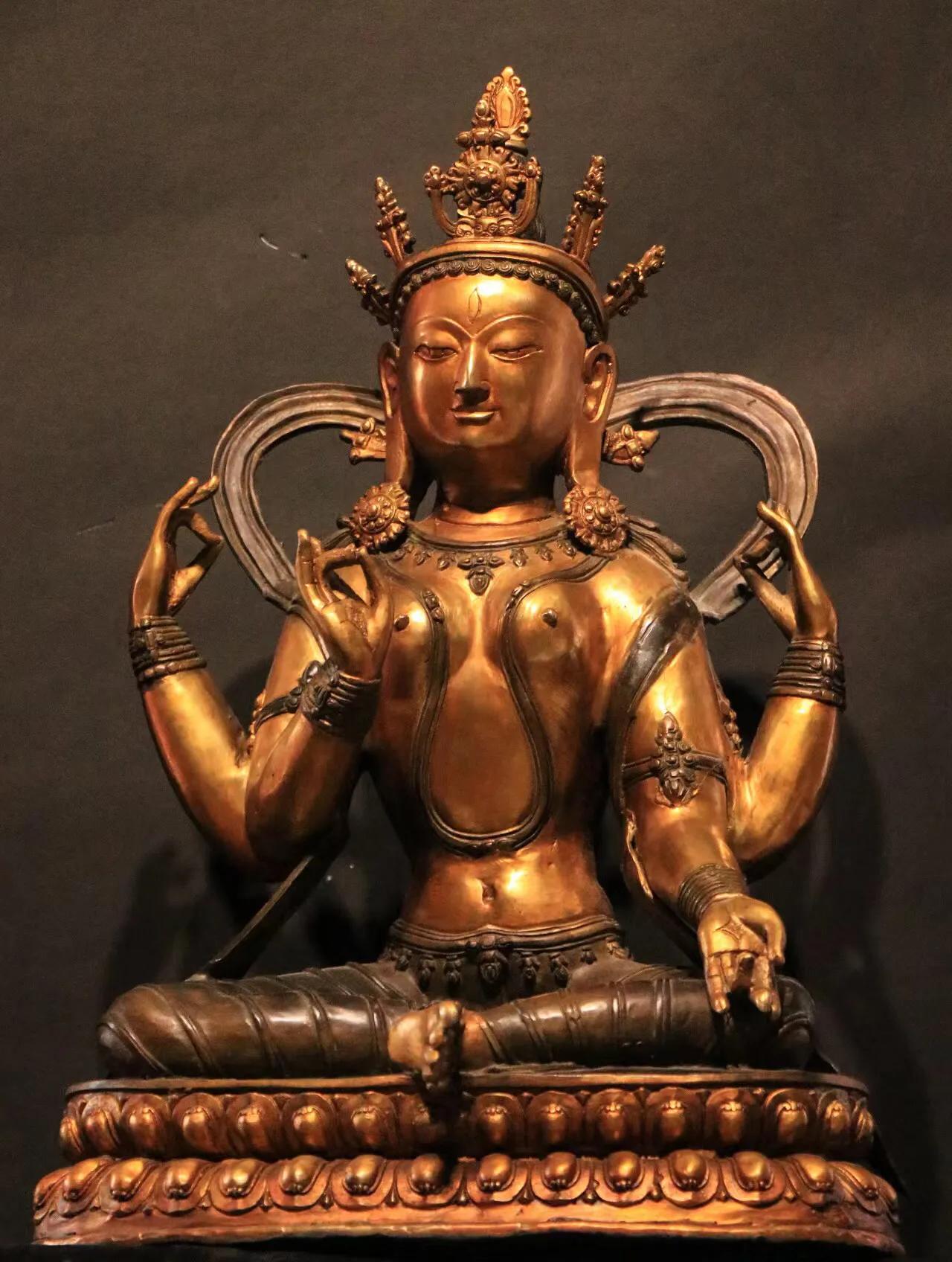 The four-armed gilt bronze statue of Tara is 50 long, 34 wide and 22 cm ...