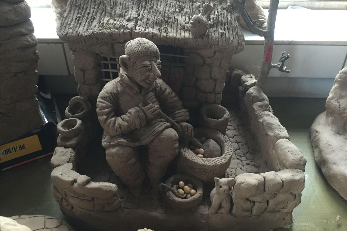 What are the attributes of clay sculpture culture and the implication ...