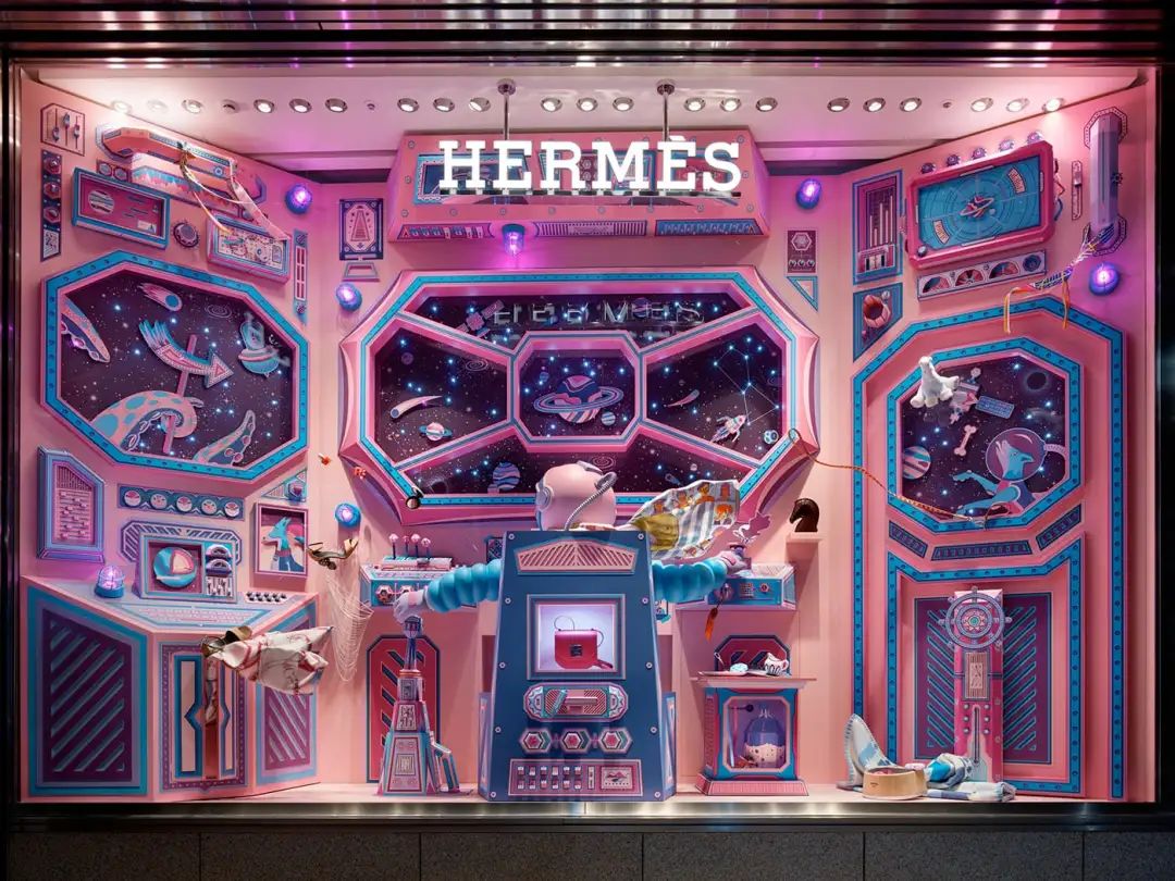 Hermès window display showing an astronaut piloting an elaborate paper ...