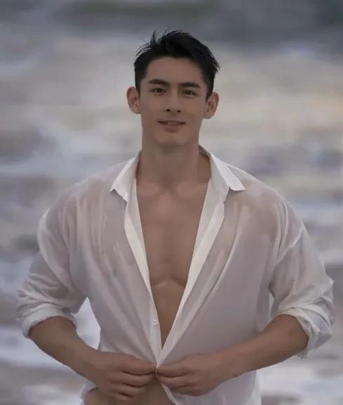 Male model photo iii: A handsome muscular male model in a white shirt ...