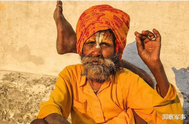 Indian ascetic monk raised his right arm high and never lowered it for ...