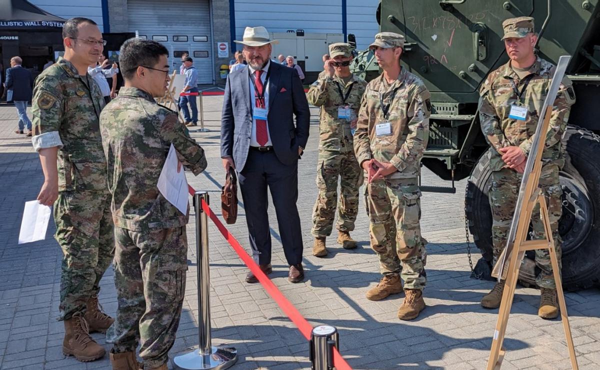 The contrast in front of Haimas is very subtle. The PLA officer is ...