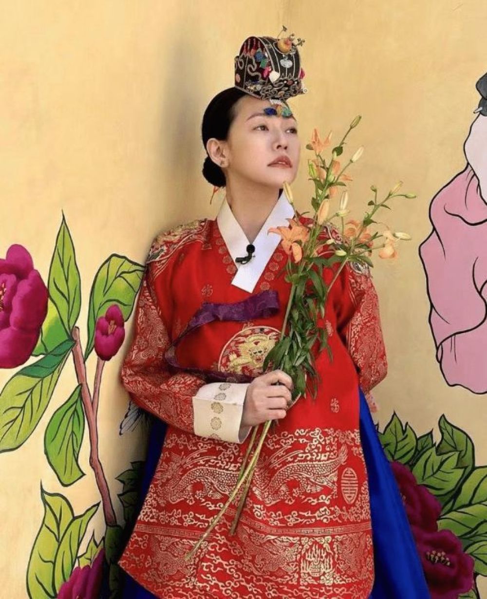 Little S is traveling in South Korea, wearing a big red Hanbok, smiling ...