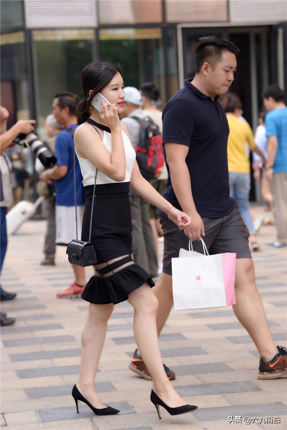 Black pointed-toe stilettos, with a black ruffled high-waisted skirt ...