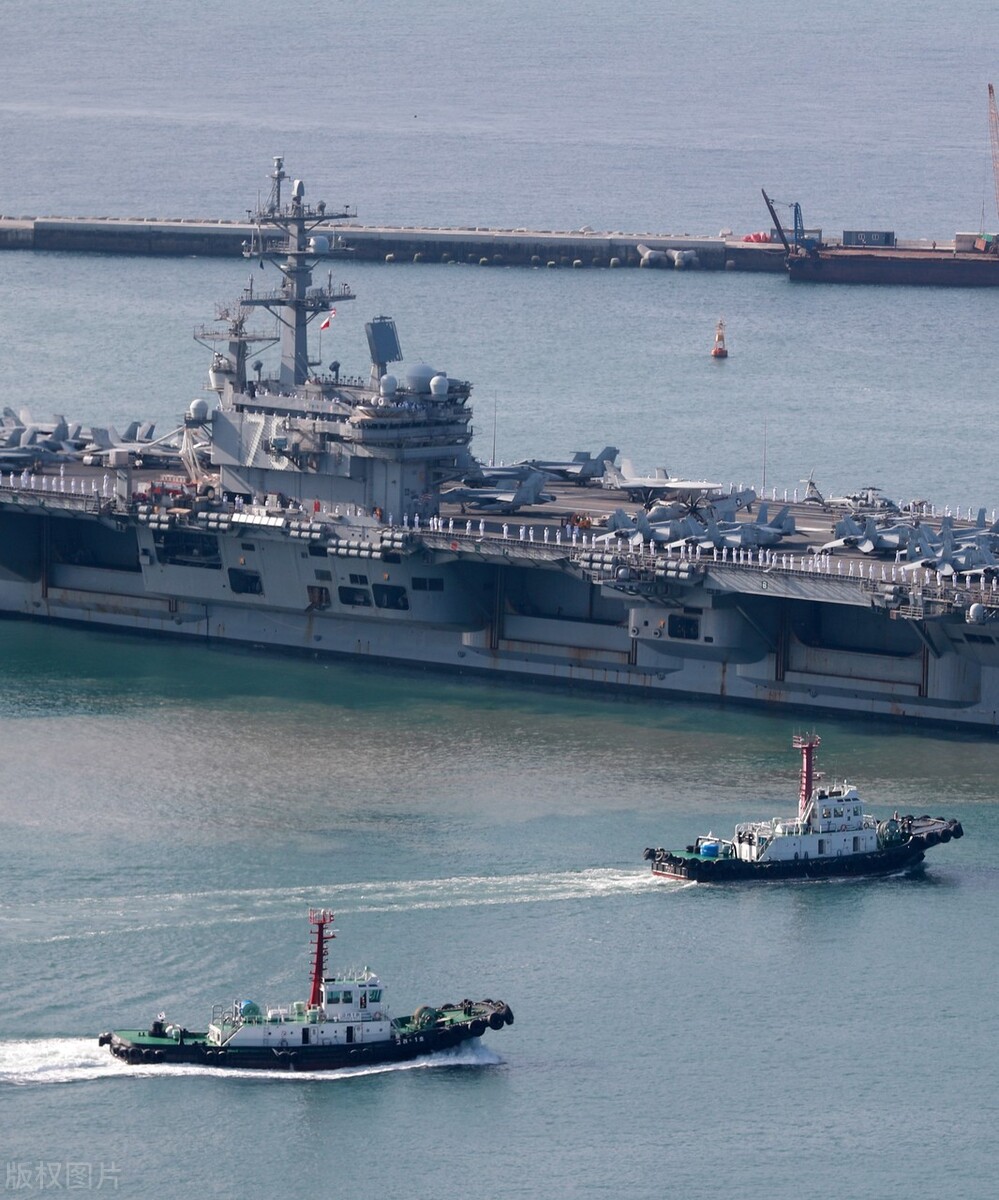 The amphibious assault ship USS America docks in Osaka, indicating that ...