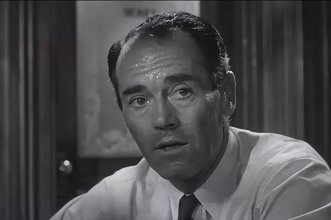 In the film "Twelve Angry Men", how does the director show the complete ...