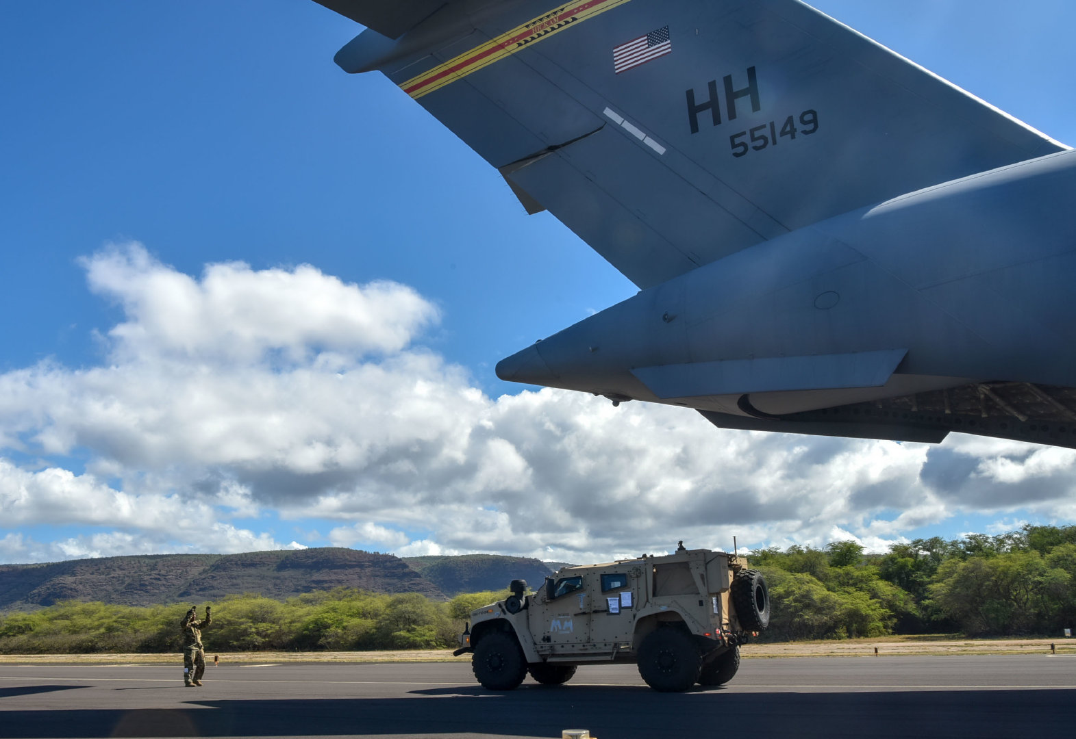 535th Airlift Squadron unloads cargo and personnel at Pacific Missile ...