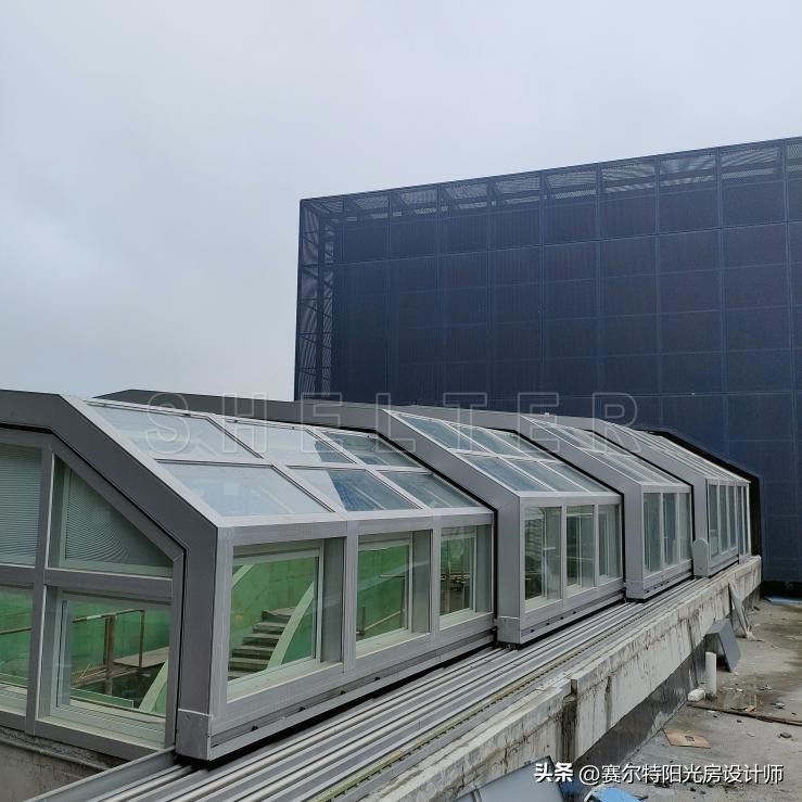 A mobile sun room is installed in the lobby of Hotel Indigo to protect ...