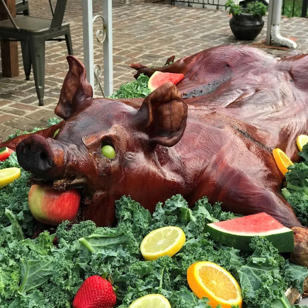 What is the origin of the apple in the mouth of the roast suckling pig ...