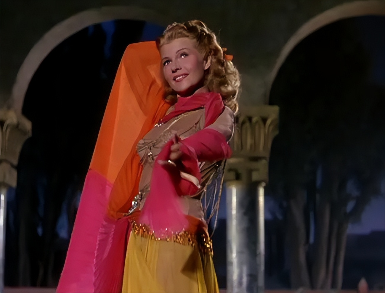 How does Hayworth's performance of "Salome" convey the emotional charm ...