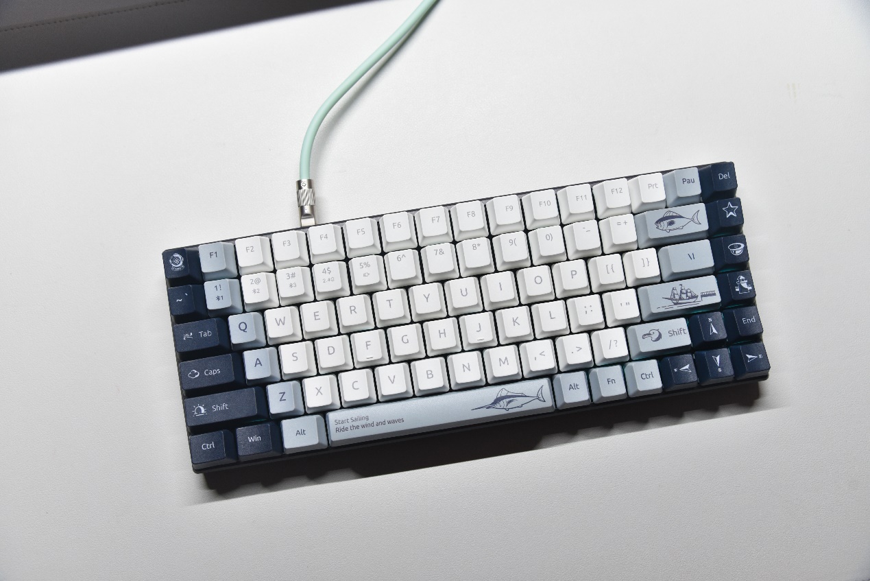 A compact 84-key mechanical keyboard with a nautical theme, it turns ...