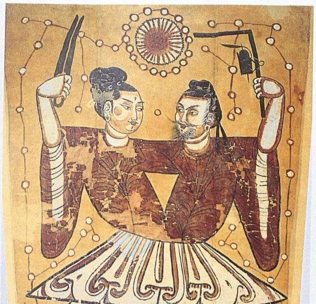 In the unearthed picture of Fuxi and Nuwa, the two people each hold a ...
