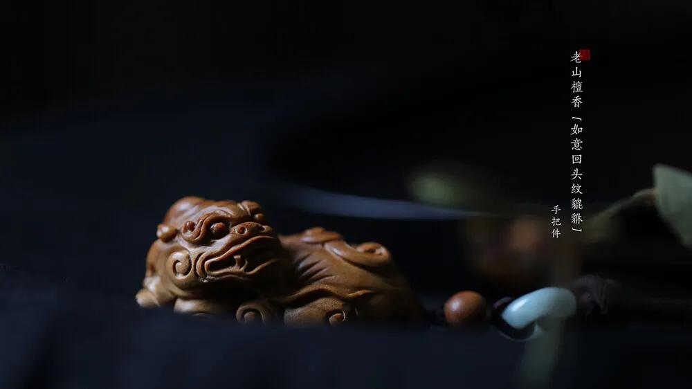 Ruyi back tattoo on Pixiu handle - iNEWS