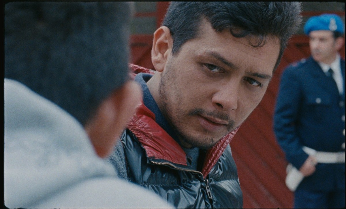 The use of light and shadow and color symbolism in the movie "Roma Boy ...