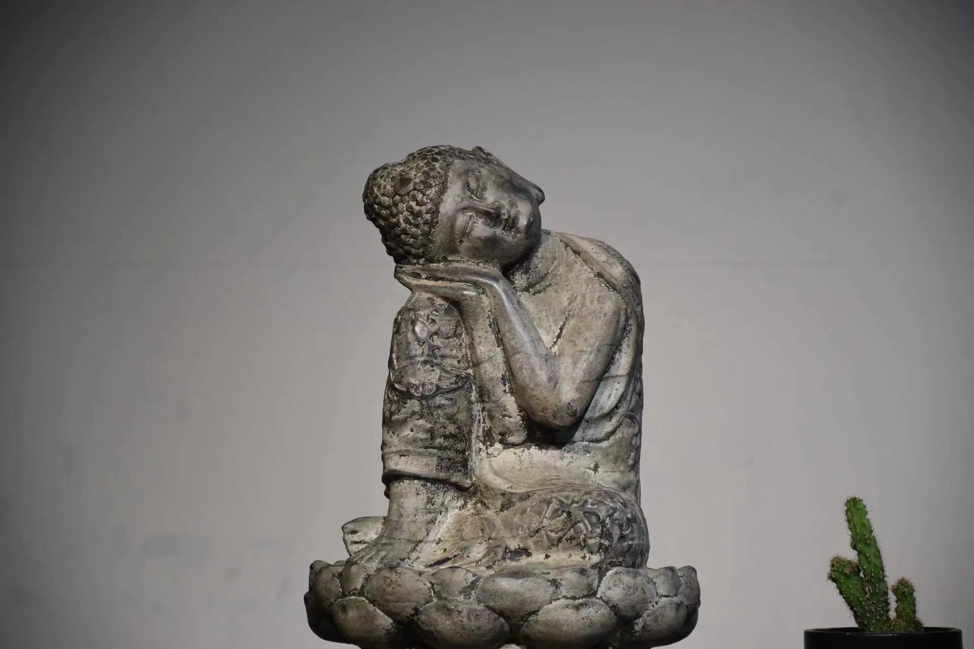 The sleeping Buddha's bluestone lotus base is wrapped around the lotus ...