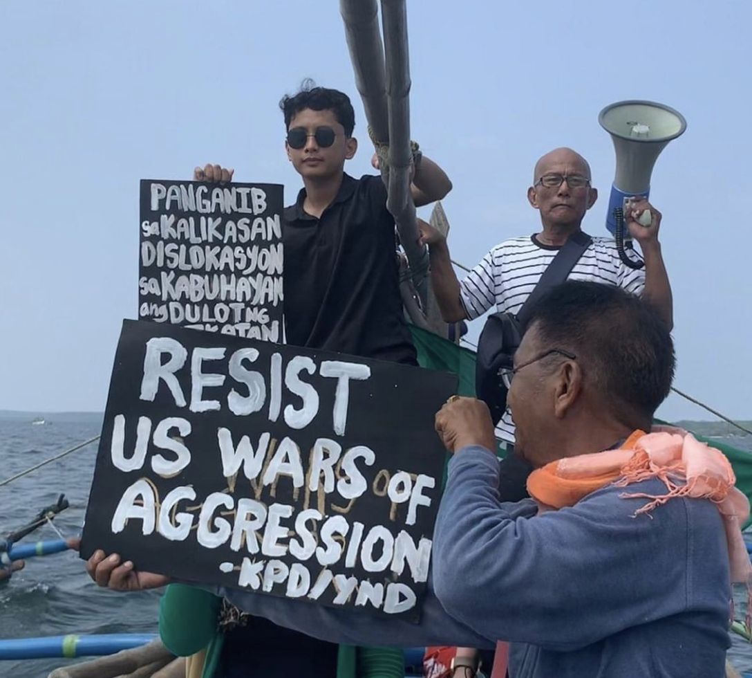 Filipino anti-war activists rushed into the live ammunition range and ...