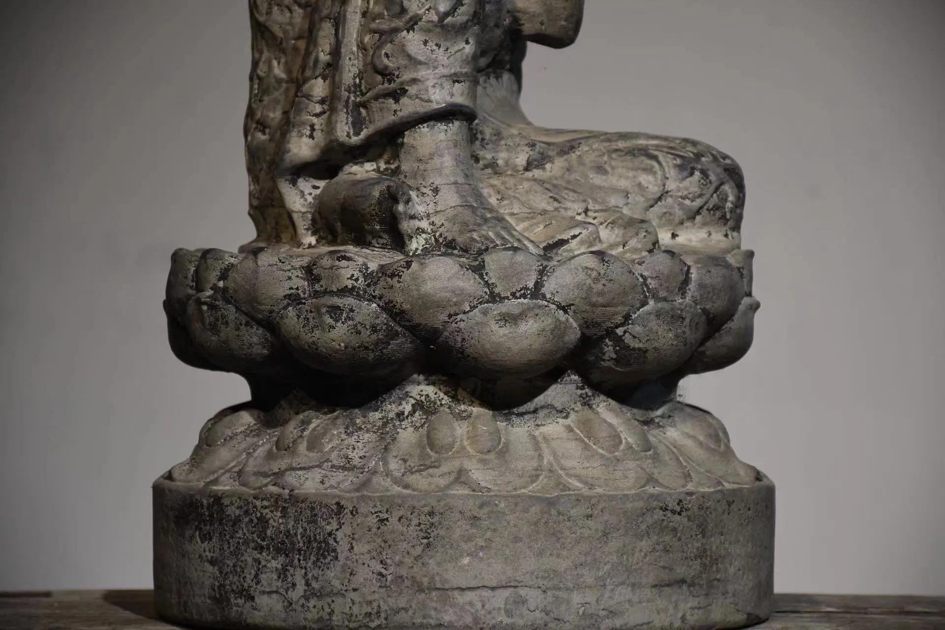 The sleeping Buddha's bluestone lotus base is wrapped around the lotus ...