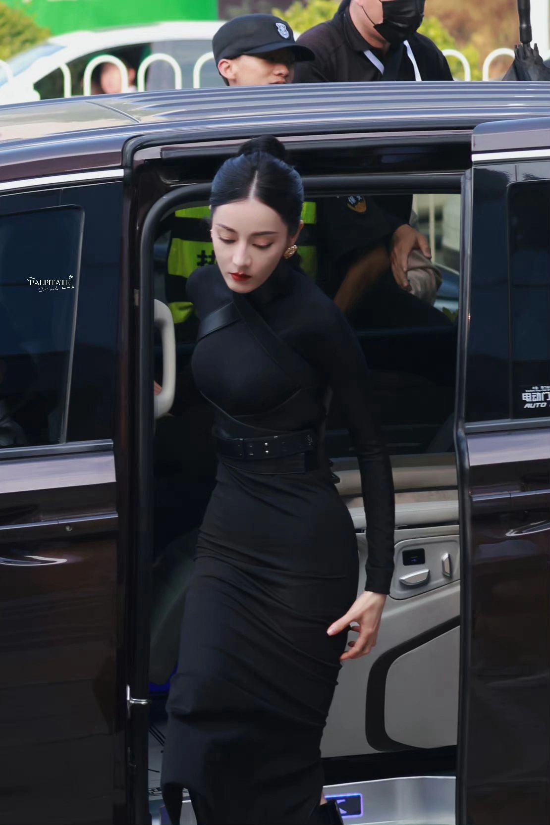 Reba wears vintage Dior earrings, and her graceful black dress is ...