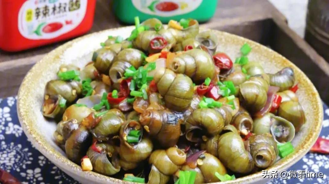 A green snail in a silver plate - delicious taste - iMedia