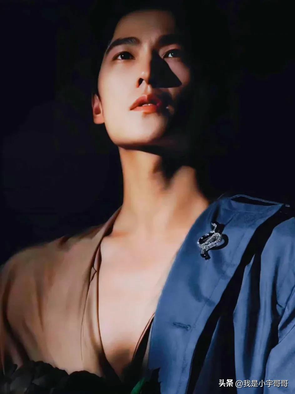 Yang Yang appeared on the cover of GQ's June issue, wearing a black ...