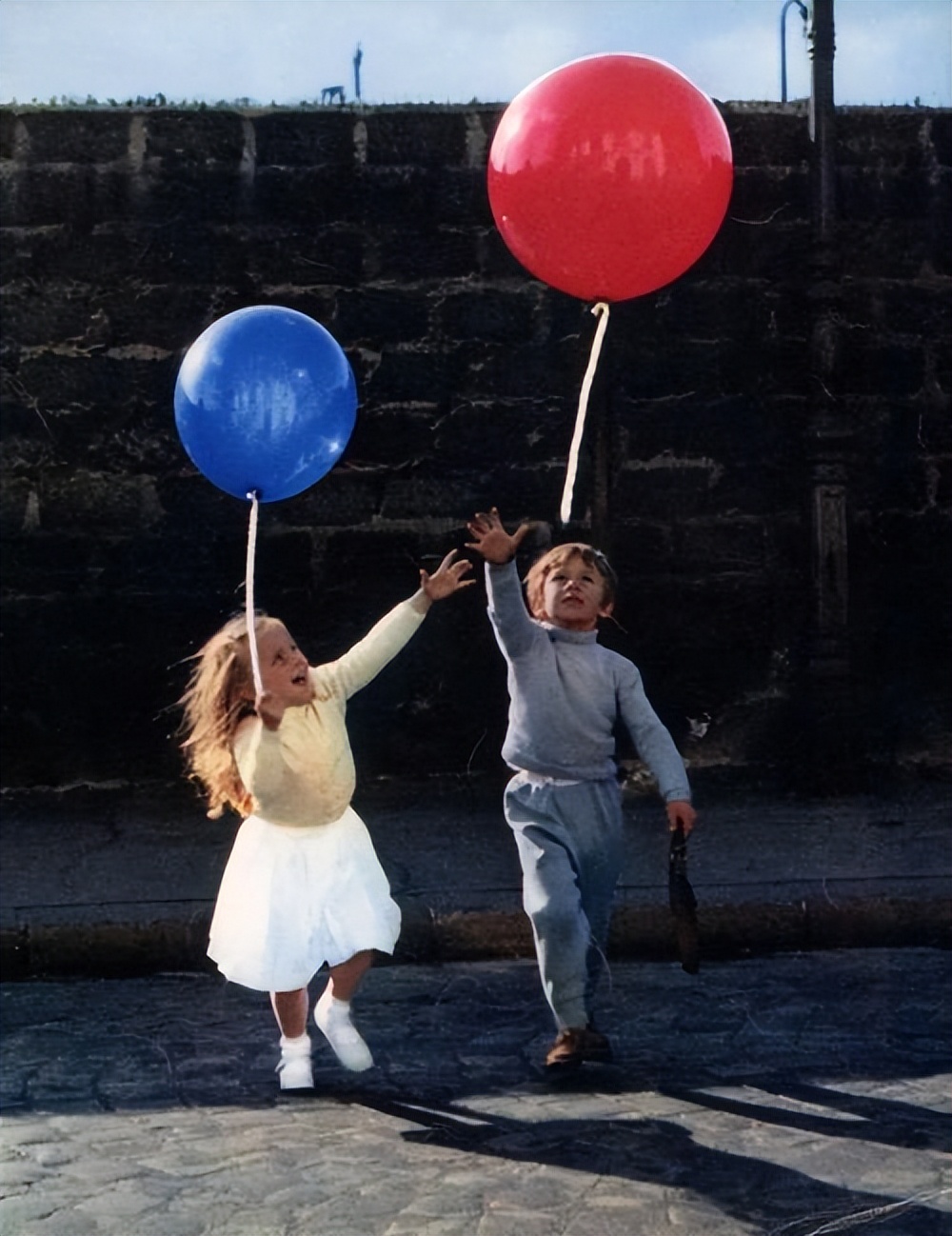 Like a star, the red balloon caught Pascal's attention, and their ...