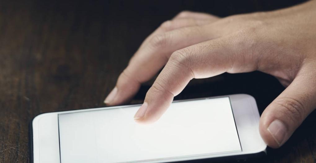 The mobile phone is placed on the table, the screen is facing up or ...