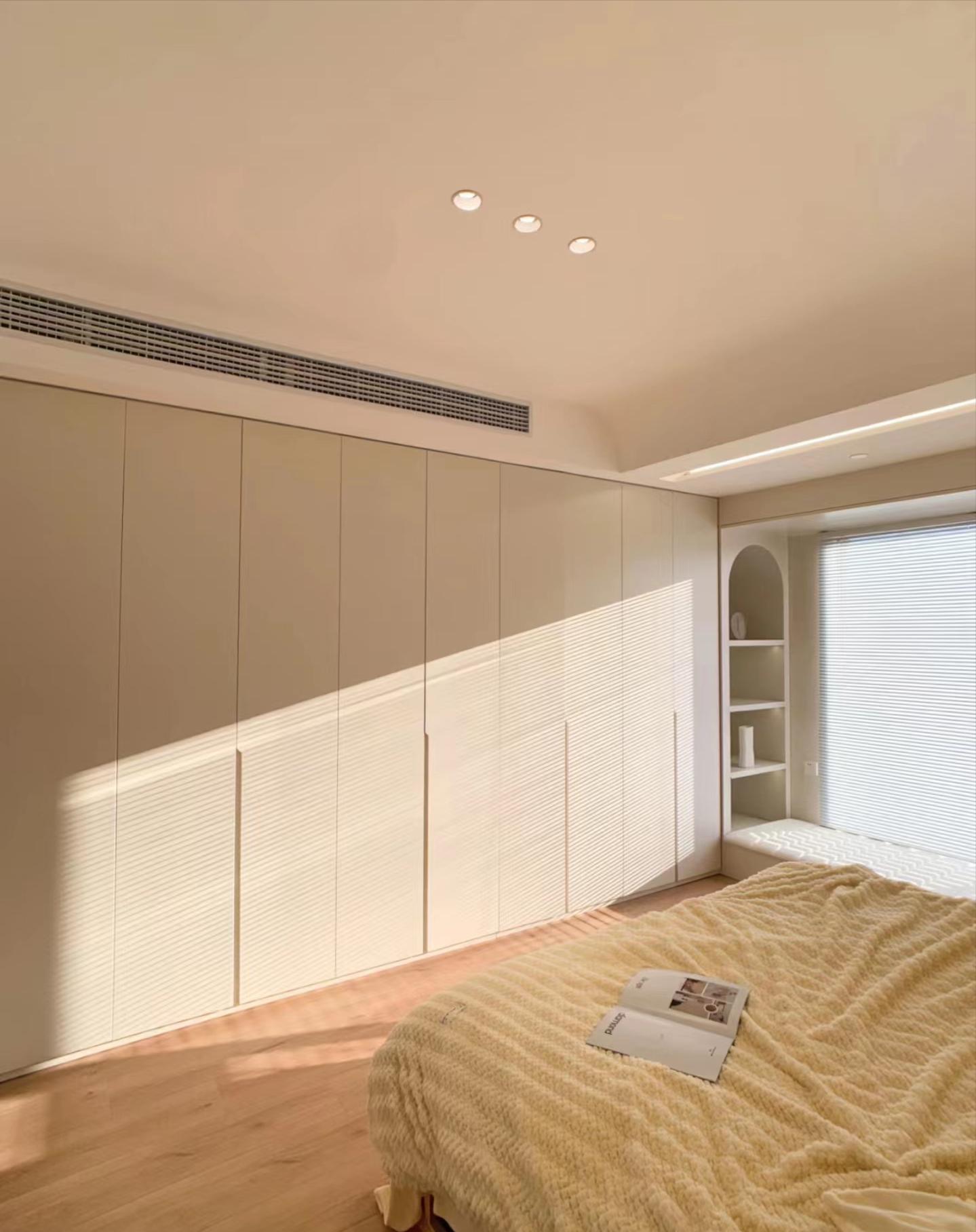The custom-made wardrobe is both internal and external, with a high ...