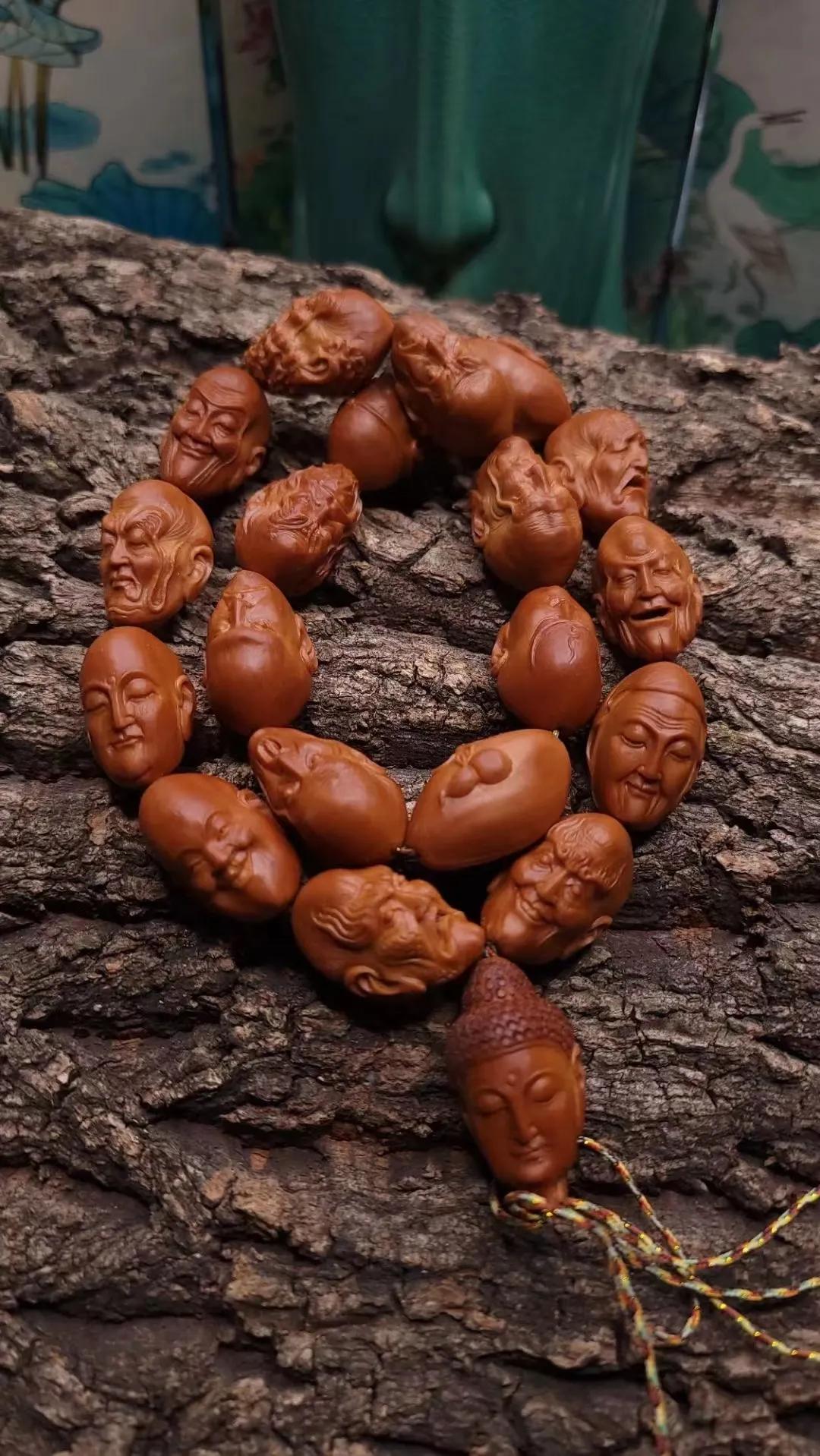 "Single-sided Arhat" olive stone carving - iNEWS