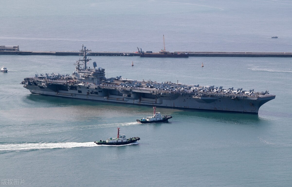 The amphibious assault ship USS America docks in Osaka, indicating that ...