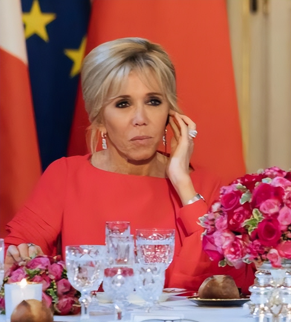 Brigitte's new look is stunning, wearing a bright red dress sparkling ...