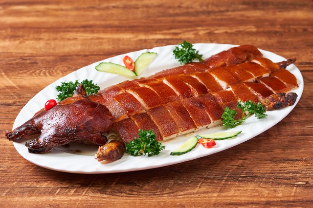 Roast suckling pig, a traditional classic delicacy, with unique ...