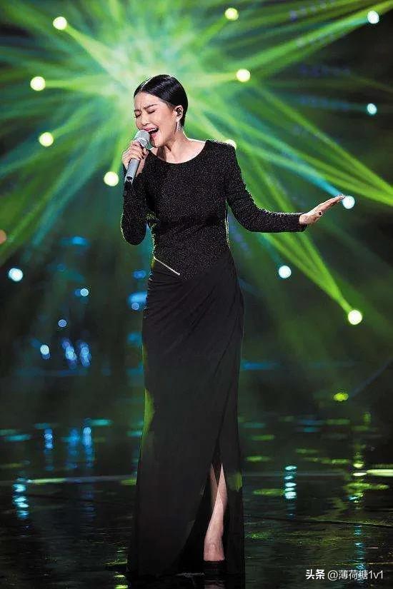 With tattooed arms and eight-pack abs, female rock singer Tan Weiwei is ...