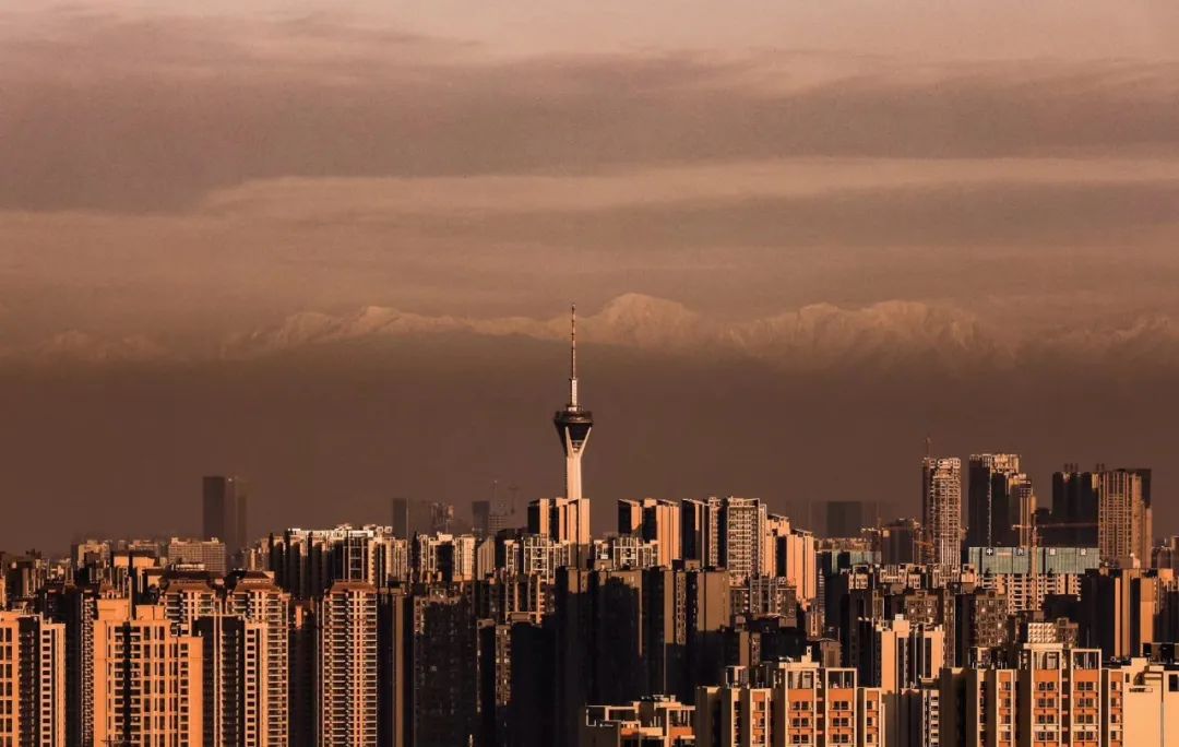I am in Chengdu, looking at the snow-capped mountains in the distance ...