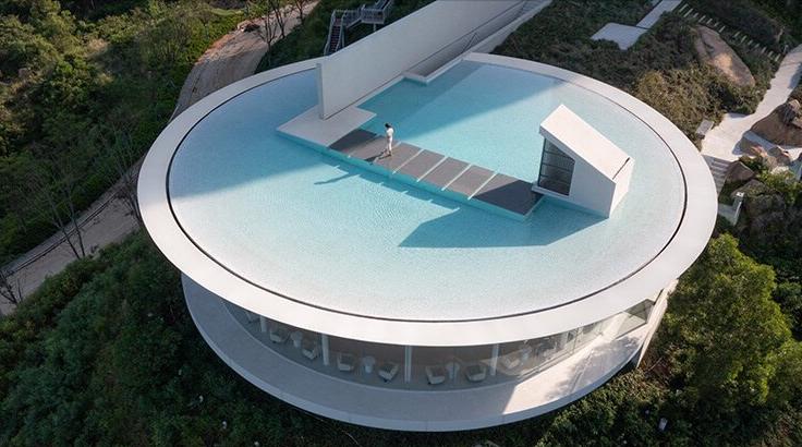 The design of this white circular library presents a poetic beauty - iNEWS