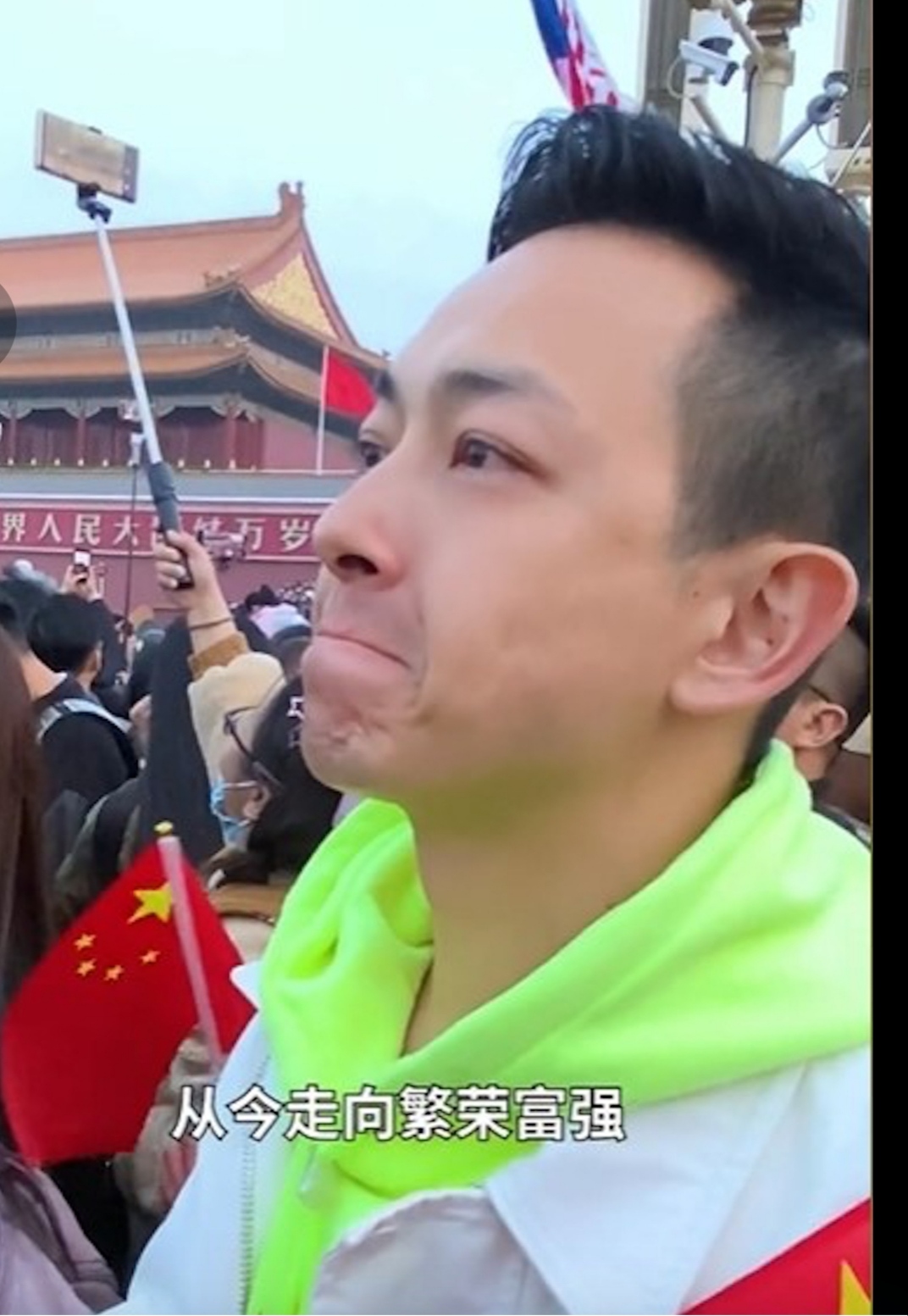 Hong Kong artist Liang Jinghui watched the flag-raising ceremony at ...