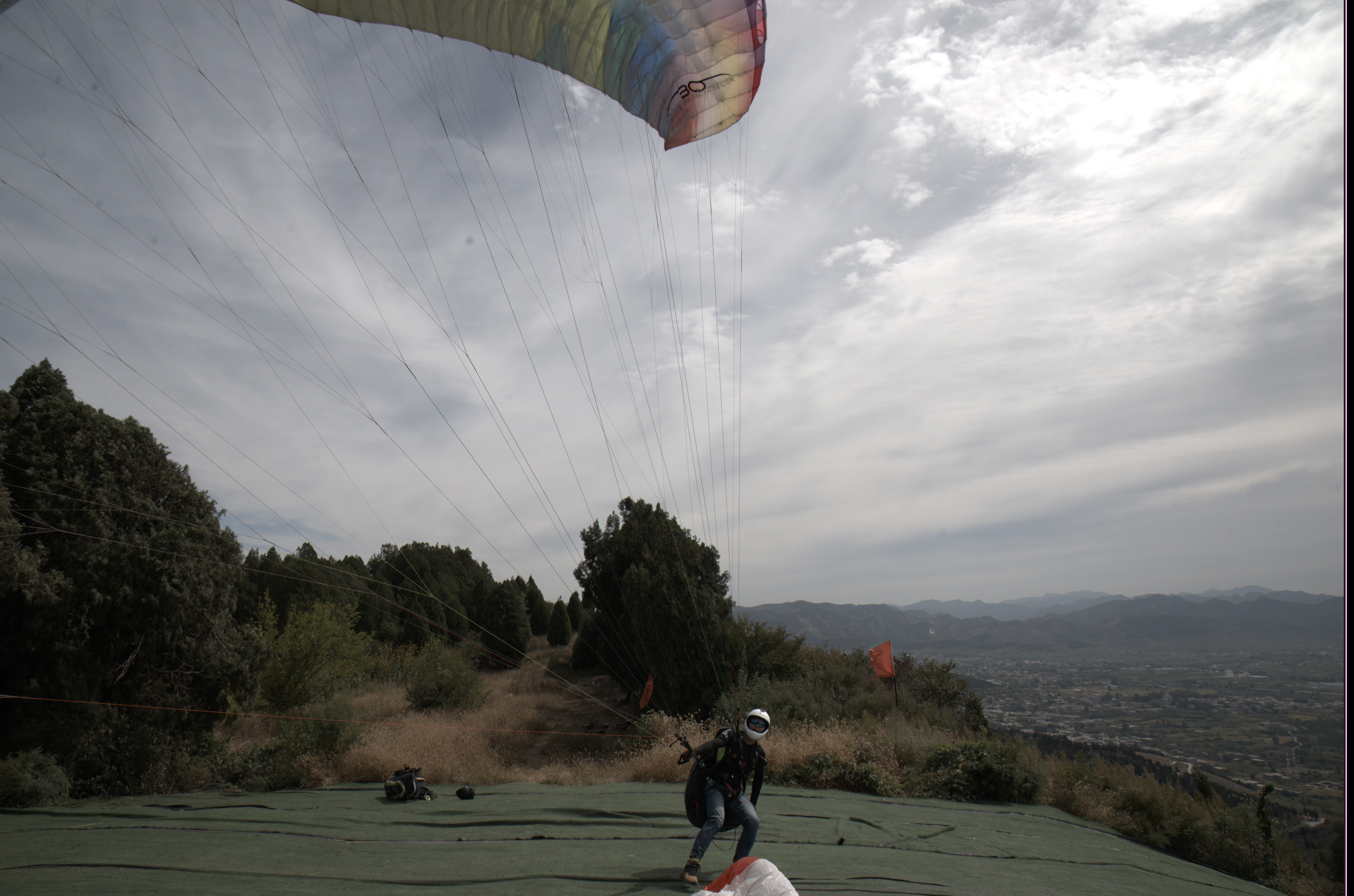 The sea of flowers on the top of the mountain, the paraglider base, the ...