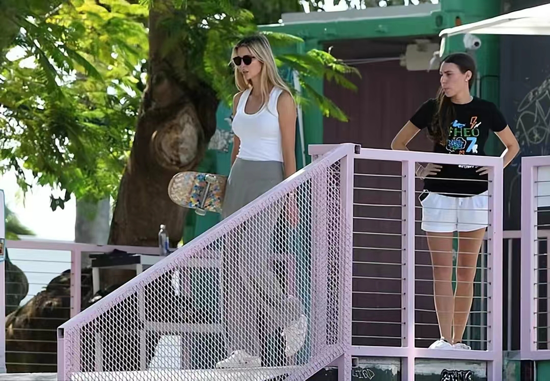 Ivanka looks like a real Barbie after tanning! Wearing a tight vest to ...